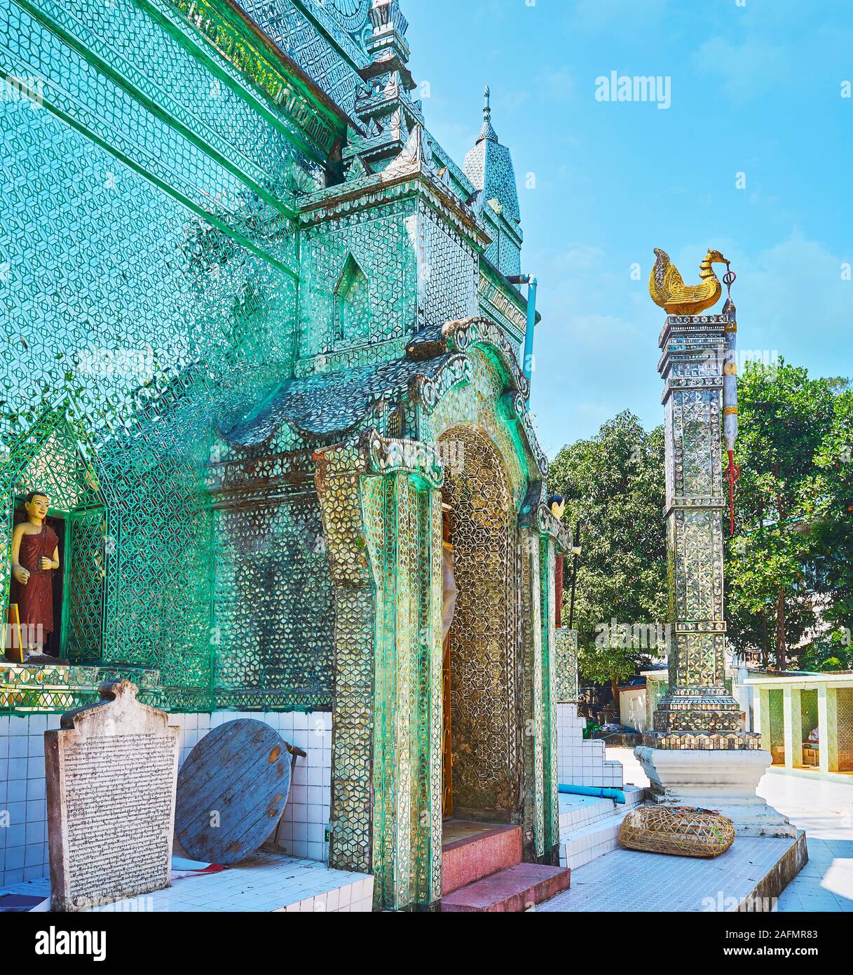 The Buddhist Pillar topped with Karaweik Bird in front of the mirrored ...