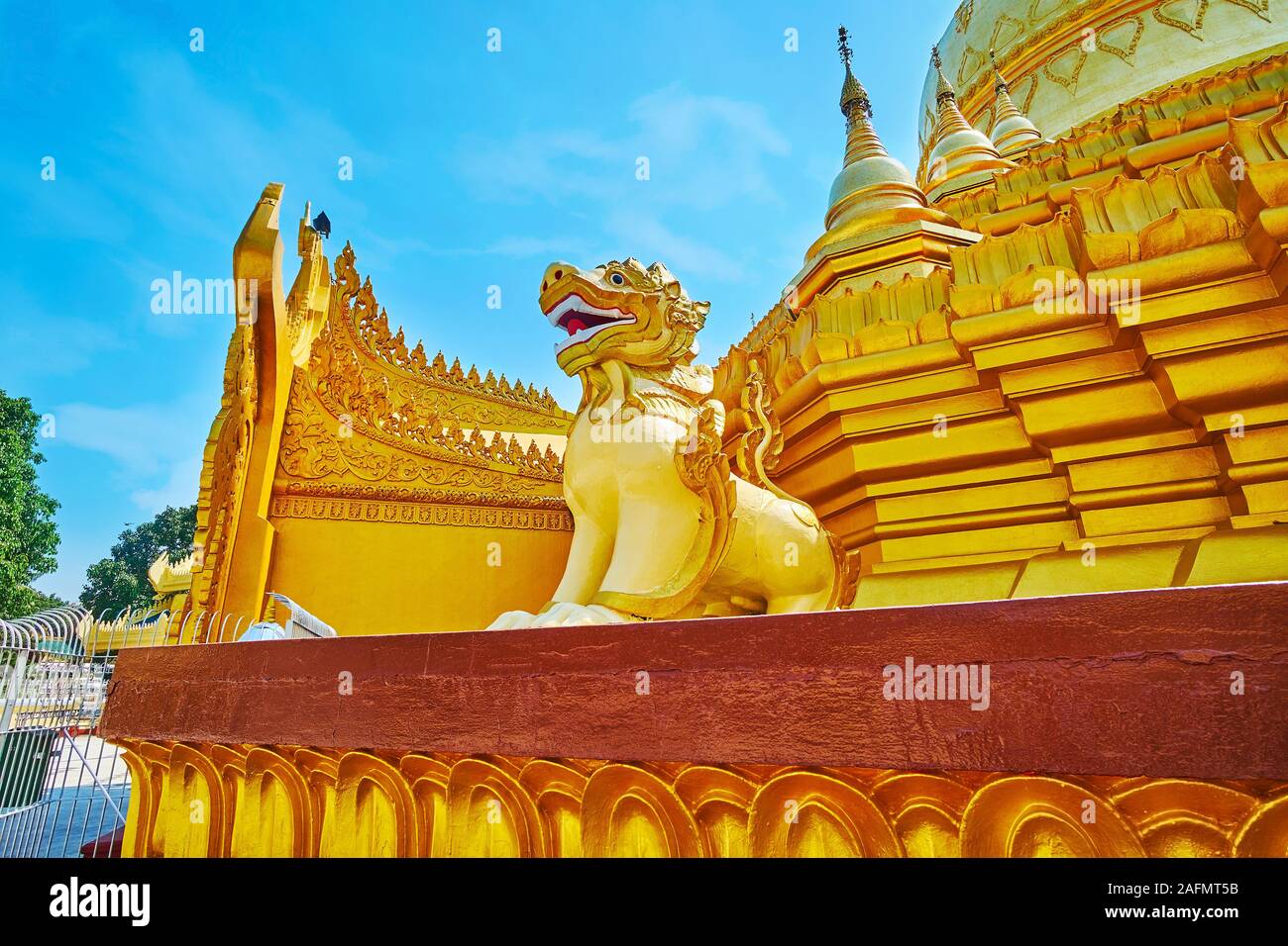 The statue of chinthe lion guardian on the side wall of Maha Wizaya ...