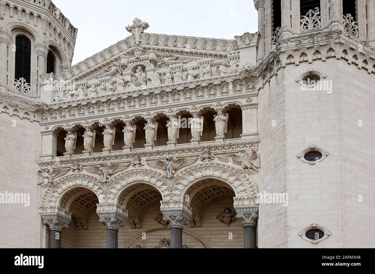 Notre Dame Basilica; ornate facade, close-up, arches, statues, towers ...