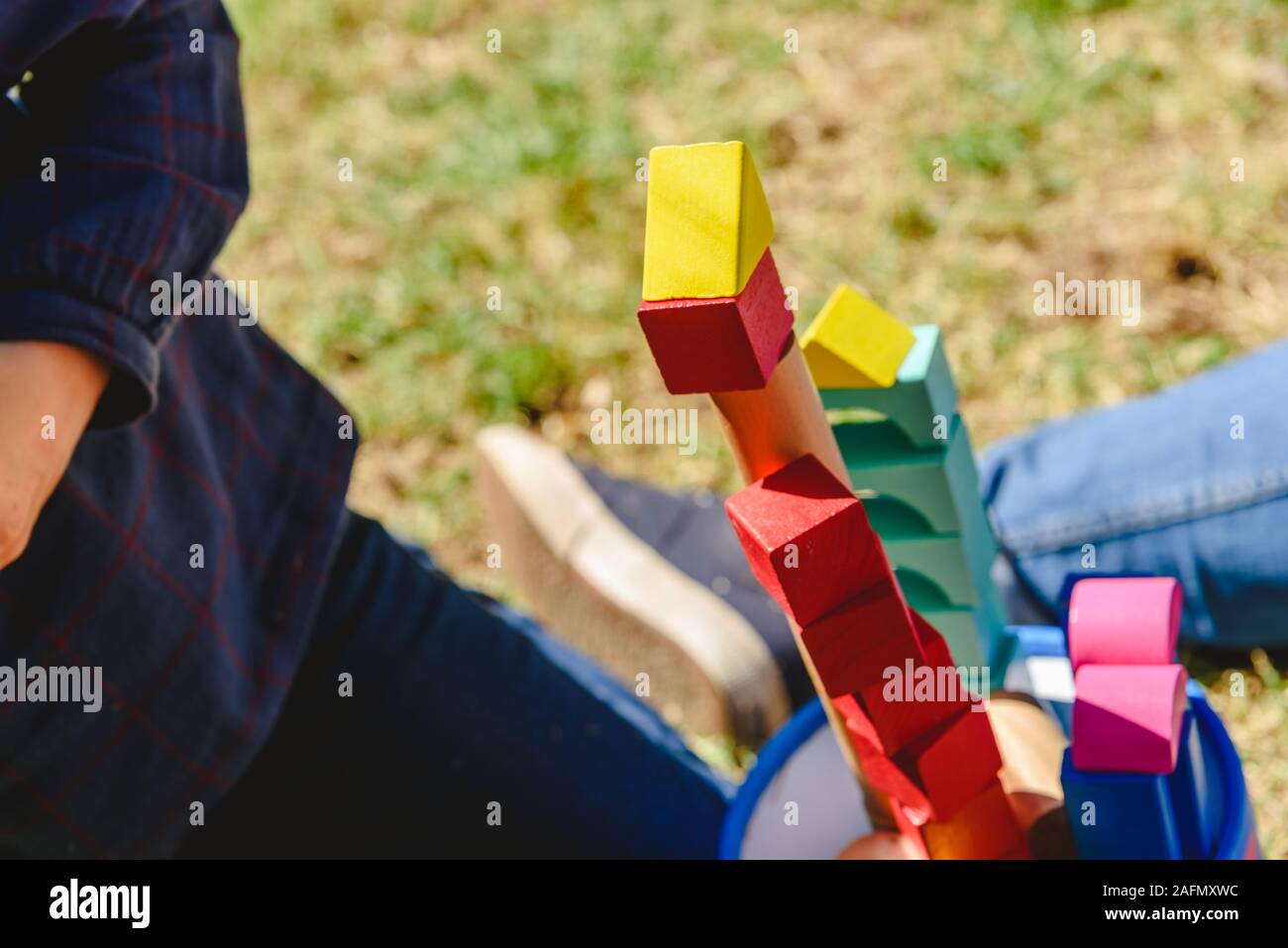 Tower of colorful wooden cubes outdoors Stock Photo - Alamy