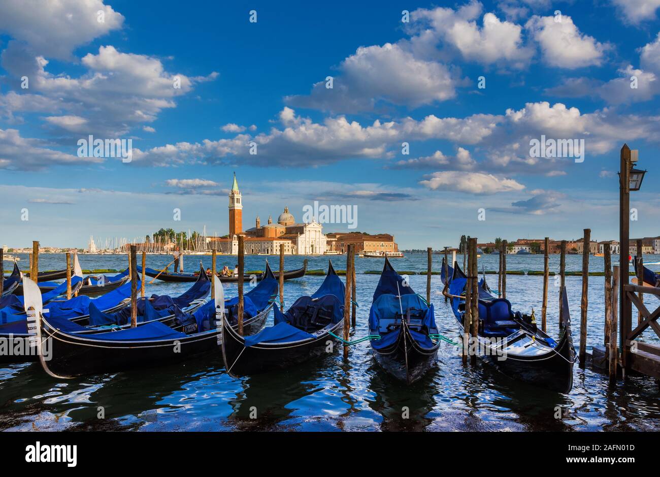 Tourism in Venice. Gondola with tourists cross the Grand Canal and the ...