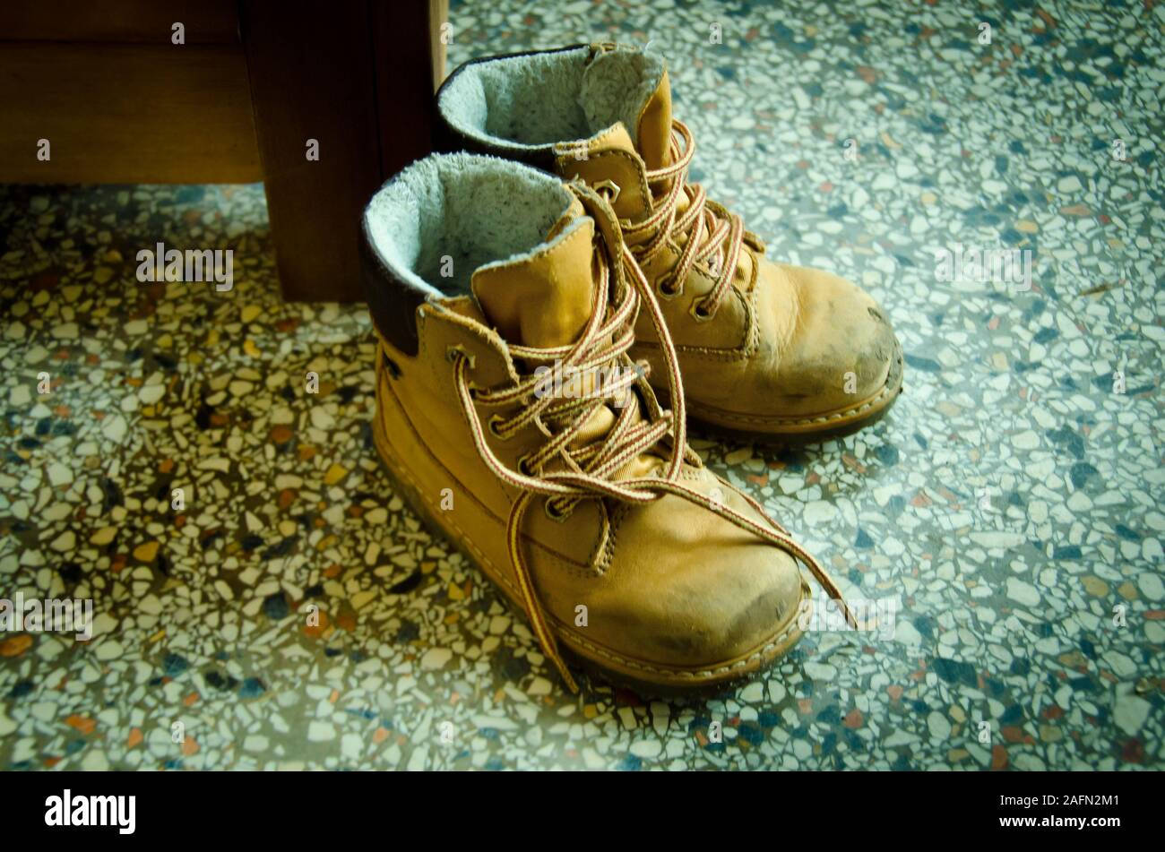 a pair of small tiny shoes for children, at the floor Stock Photo - Alamy
