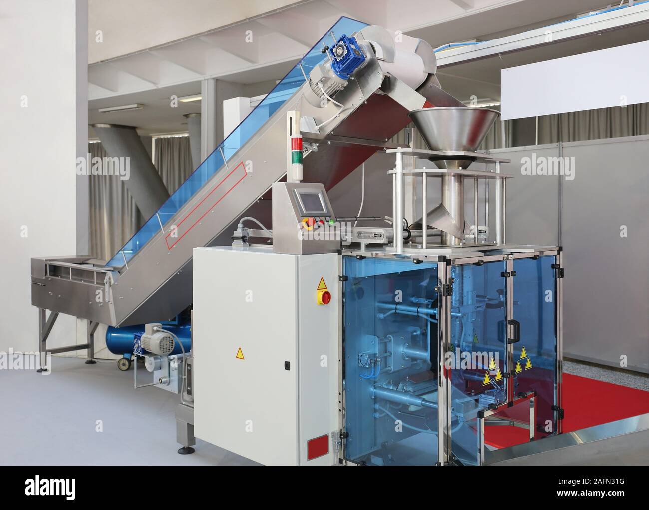 Automated Packing Machine With Conveyor in Food Factory Stock Photo - Alamy