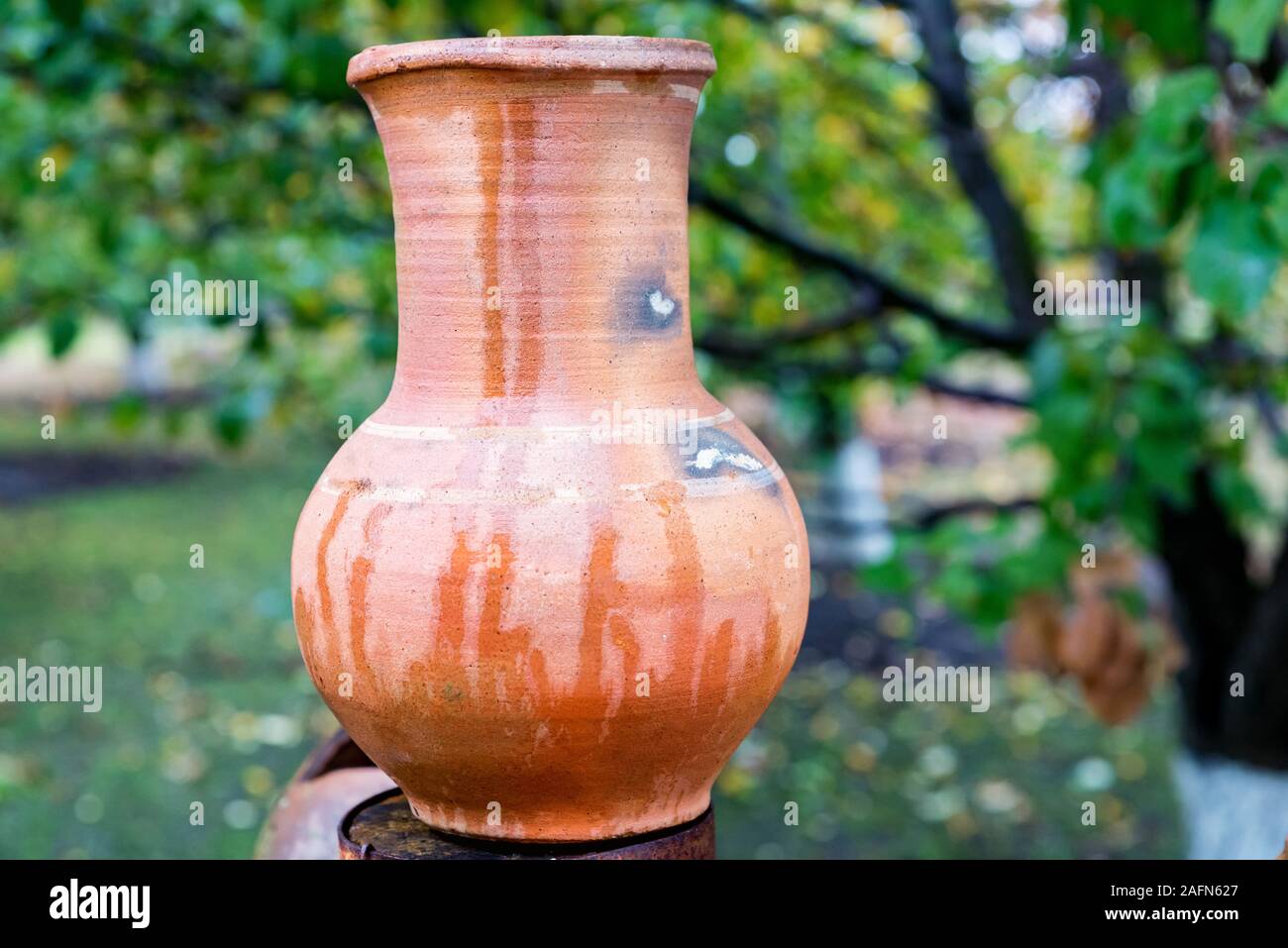 View of tradtional brown pot exposed outside Stock Photo - Alamy