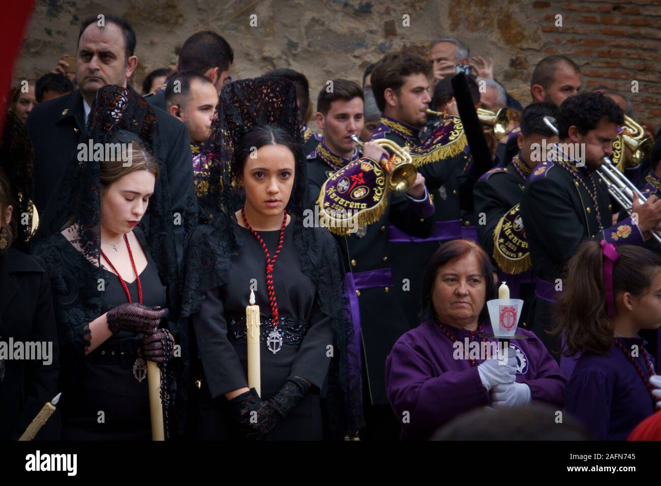 Girls in Easter procession with a black lace mantilla, a traditional ...