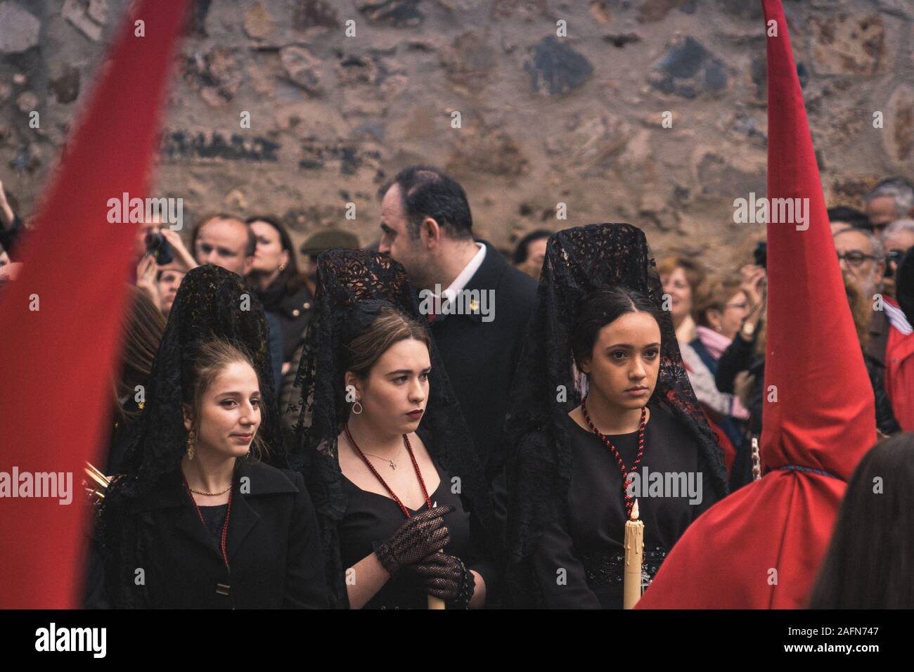 Girls in Easter procession with a black lace mantilla, a traditional ...