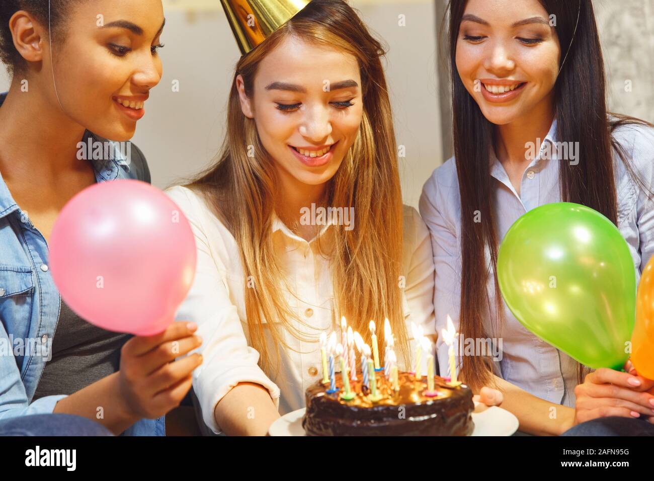 Group of friends having party indoors fun together birthday cake Stock ...