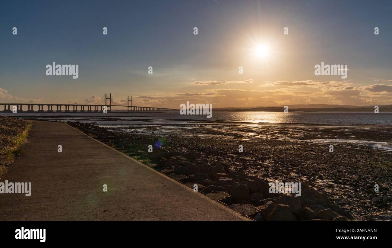 The setting sun at the The Prince of Wales Bridge and the River Severn ...