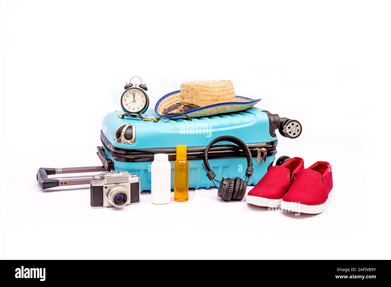 Blue suitcase luggage and travelling objects with trekking slip ...