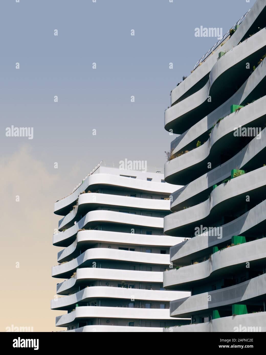 Vertical low angle shot of two beautiful buildings under the blue sky ...