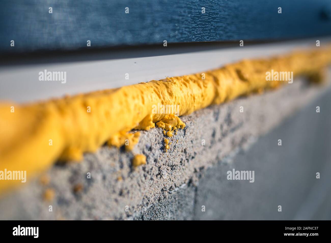 DIY concept. Construction PU - poly urethane foam. The window is ...