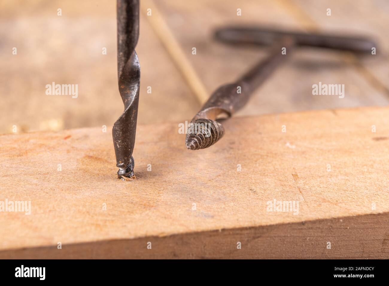 Manual drill for making holes in wood. Carpentry tools on a workshop ...