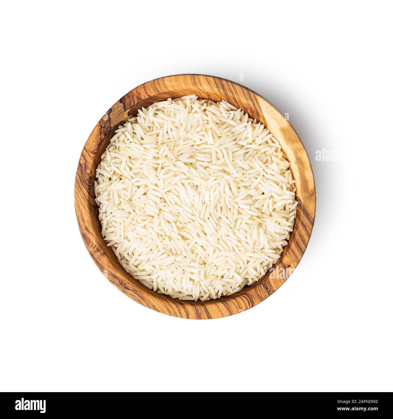 Uncooked indian long rice in bowl isolated on white background Stock ...