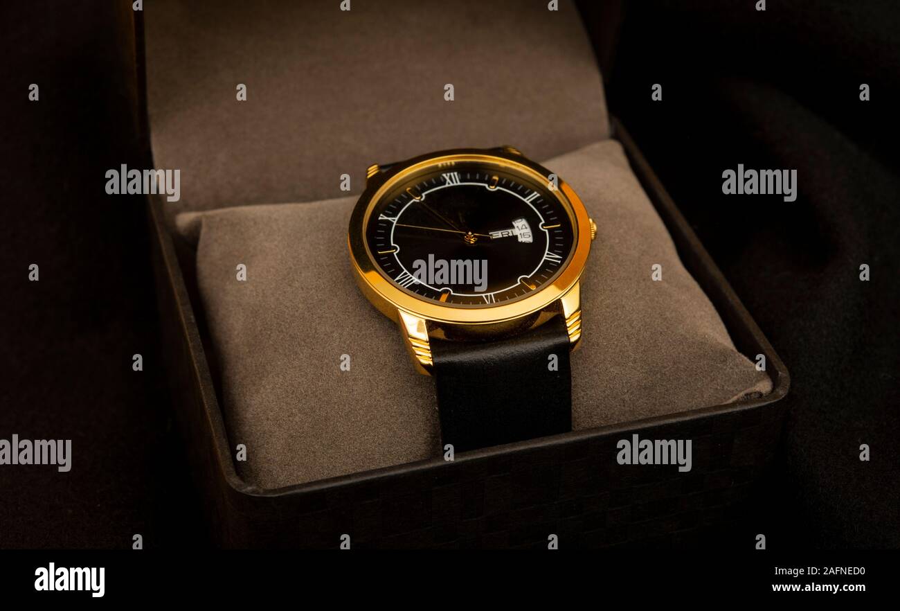 Luxury style golden hand watch in gift box on black background Stock ...
