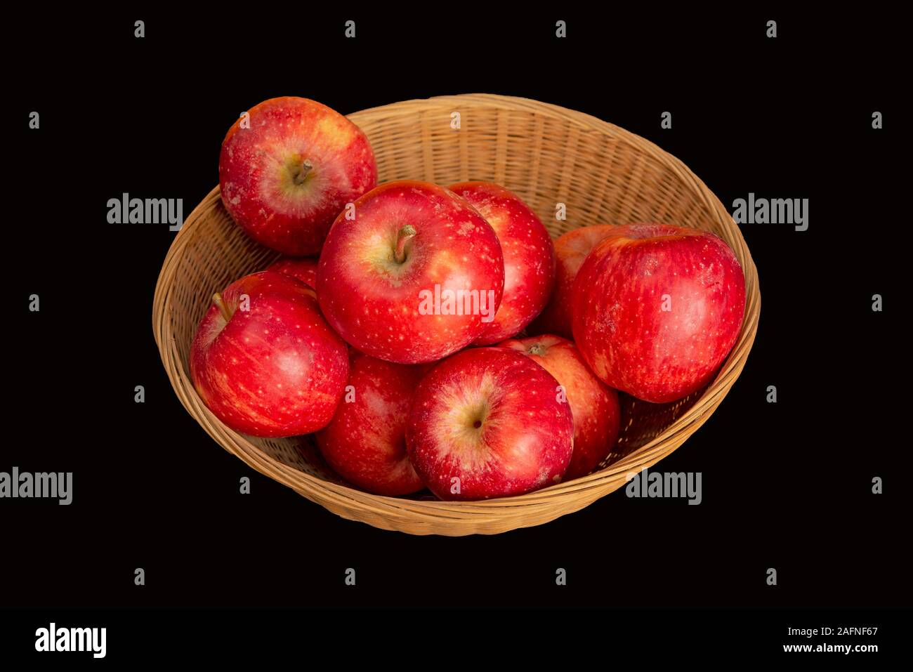 Fresh red apples in basket on black background with copy space Stock ...