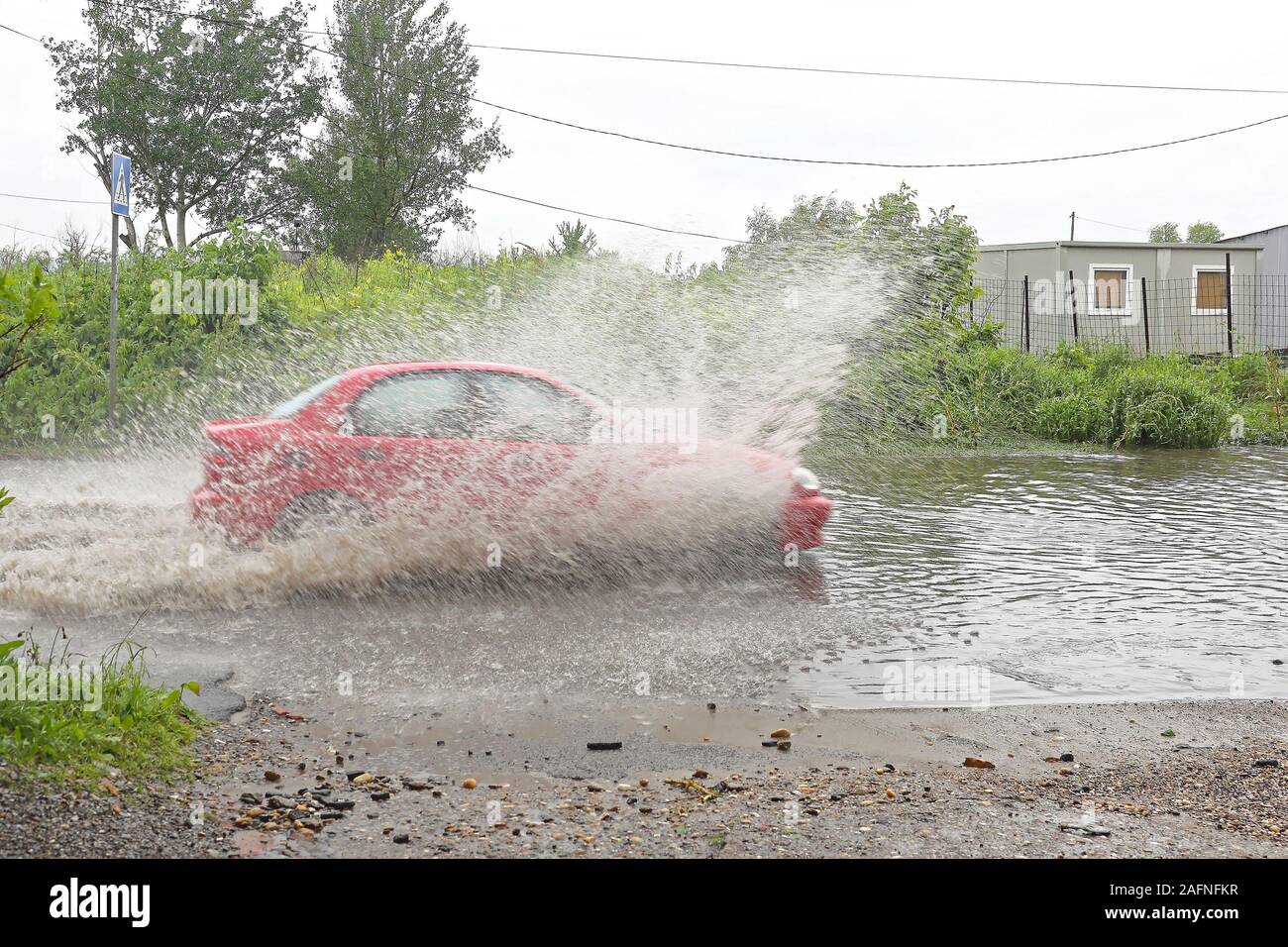 Aquaplaning Vehicle Driving Fast Through Water Stock Photo - Alamy