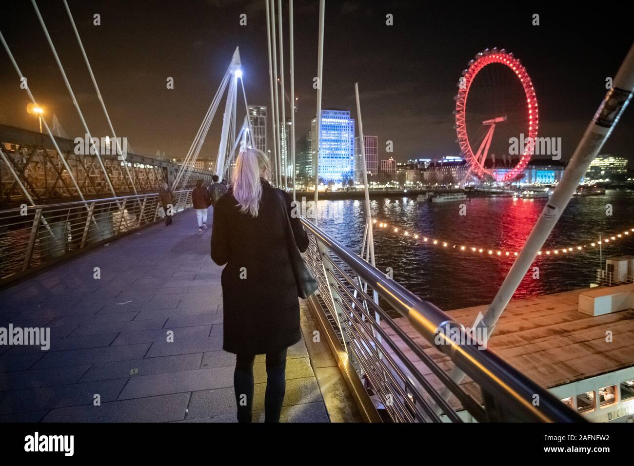 Girl walking over bridge london hi-res stock photography and images - Alamy