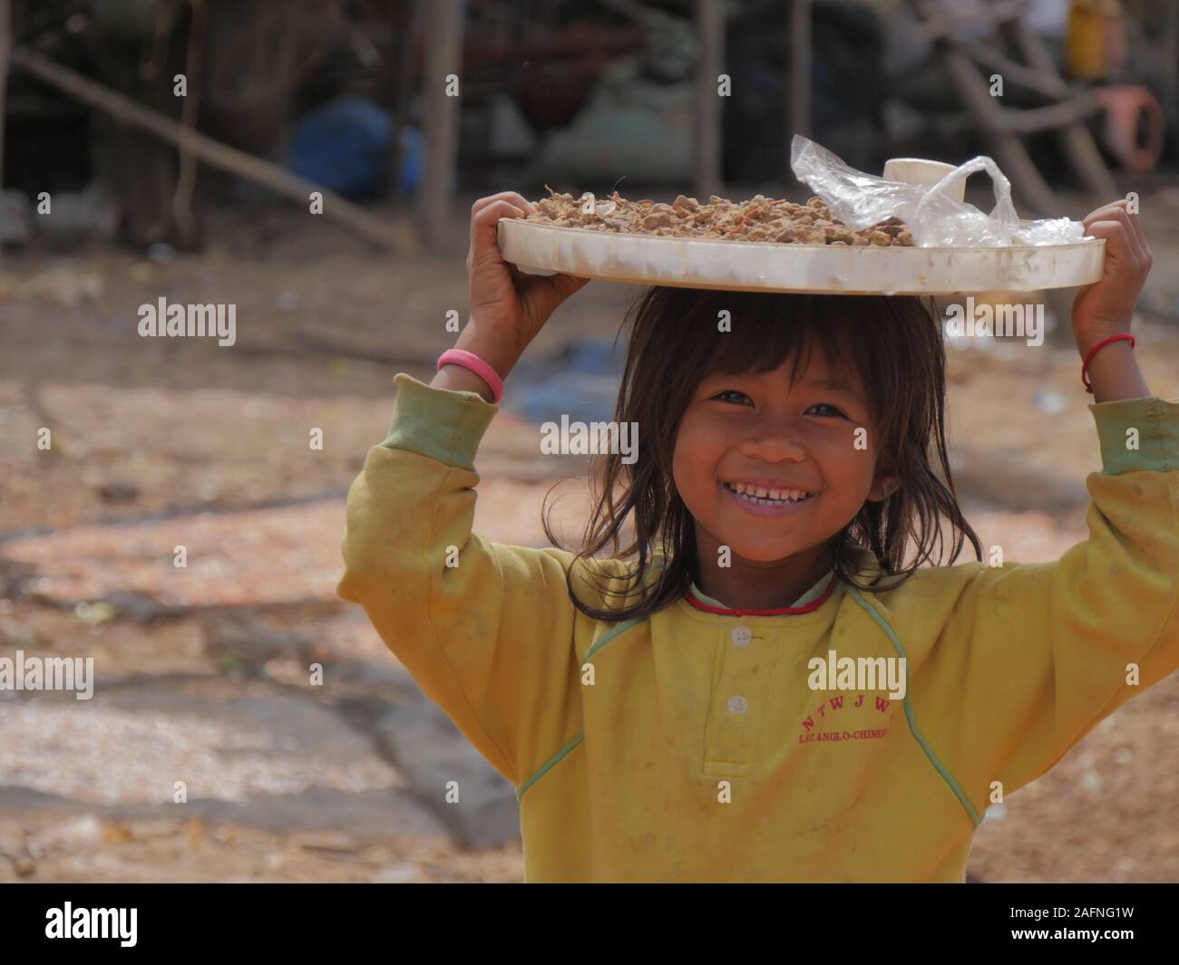 Young Cambodian girl working with smile Stock Photo - Alamy
