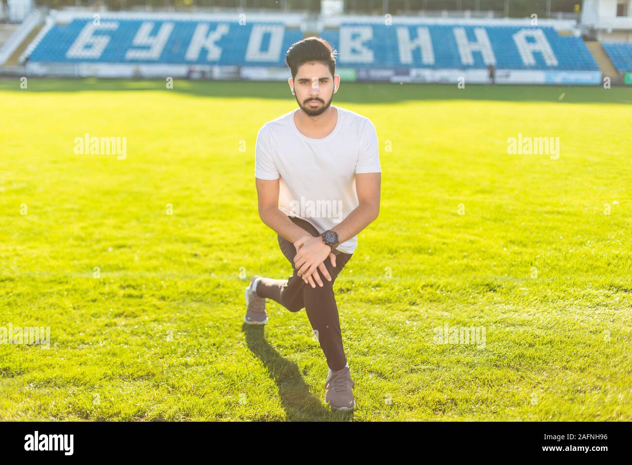 Indian man work out fitness exercises at the stadium Stock Photo - Alamy