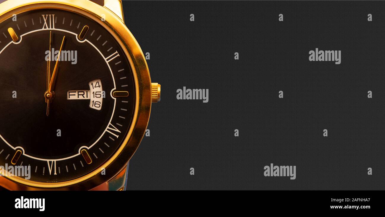 Luxury style golden hand watch top view on yellow background with copy ...