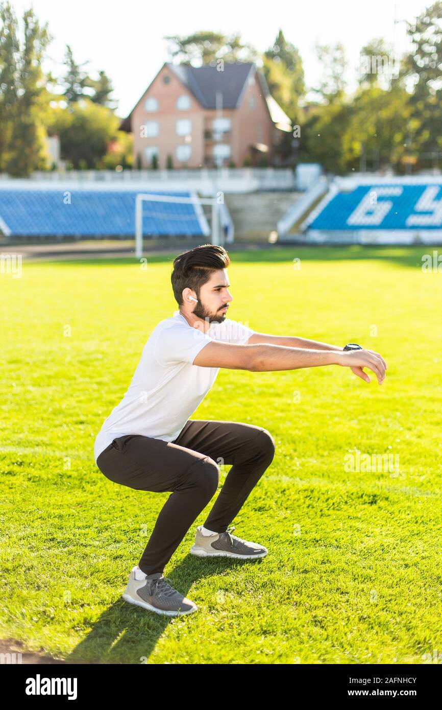 Indian man work out fitness exercises at the stadium Stock Photo - Alamy