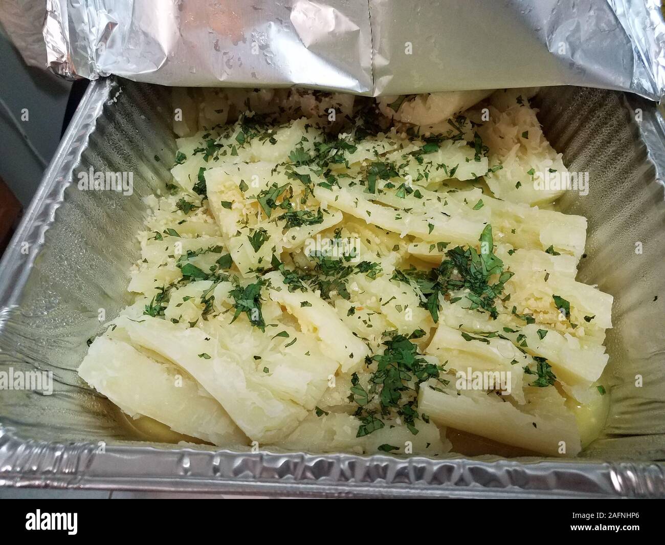 Puerto Rico food yuca root with cilantro in foil container Stock Photo ...