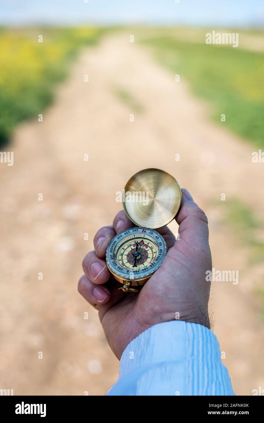 Hand holding a compass hi-res stock photography and images - Alamy