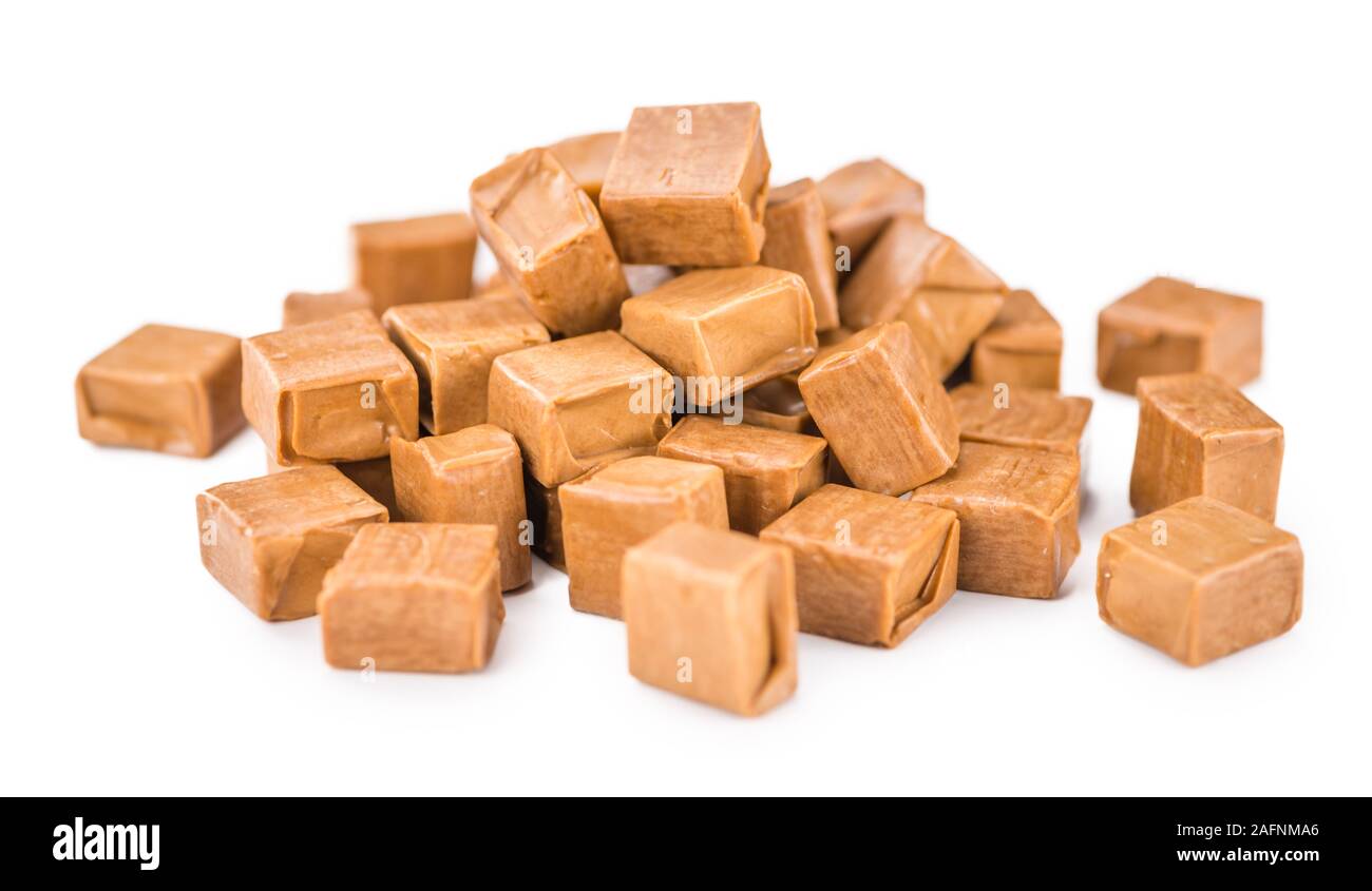 Portion of Caramel (as close-up shot) isolated on white background ...