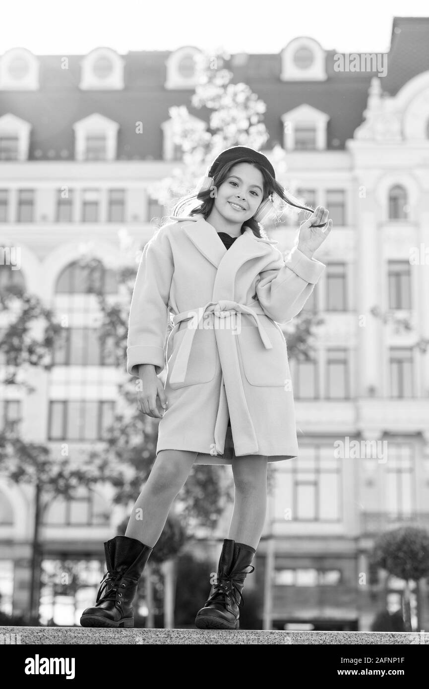 Stereo sound. Child girl autumn outfit enjoying music. Little girl ...