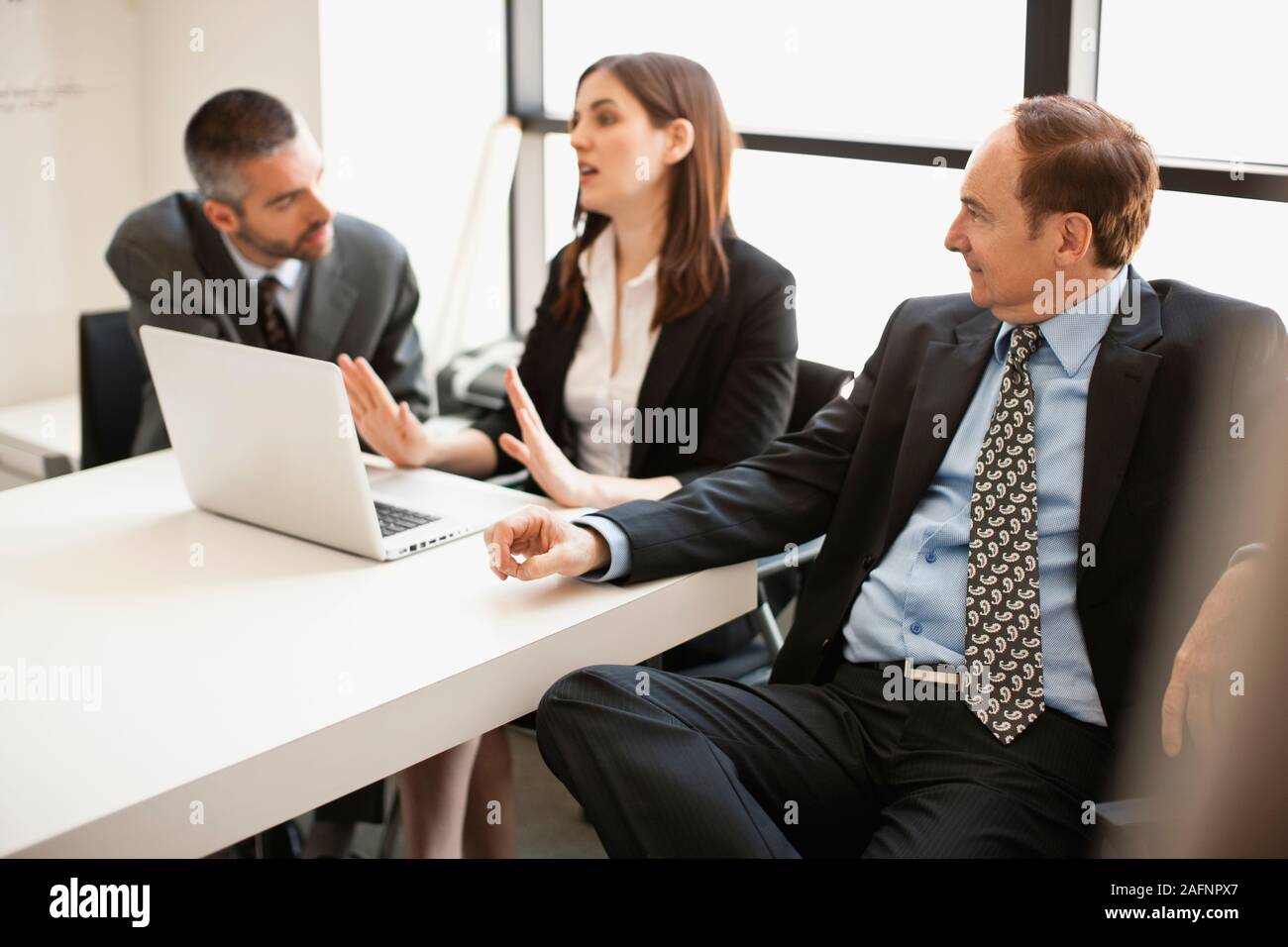 Small group of business people in a meeting Stock Photo - Alamy