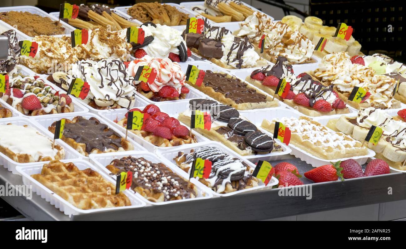 display of fresh belgian waffles small with flags in brussels Stock ...