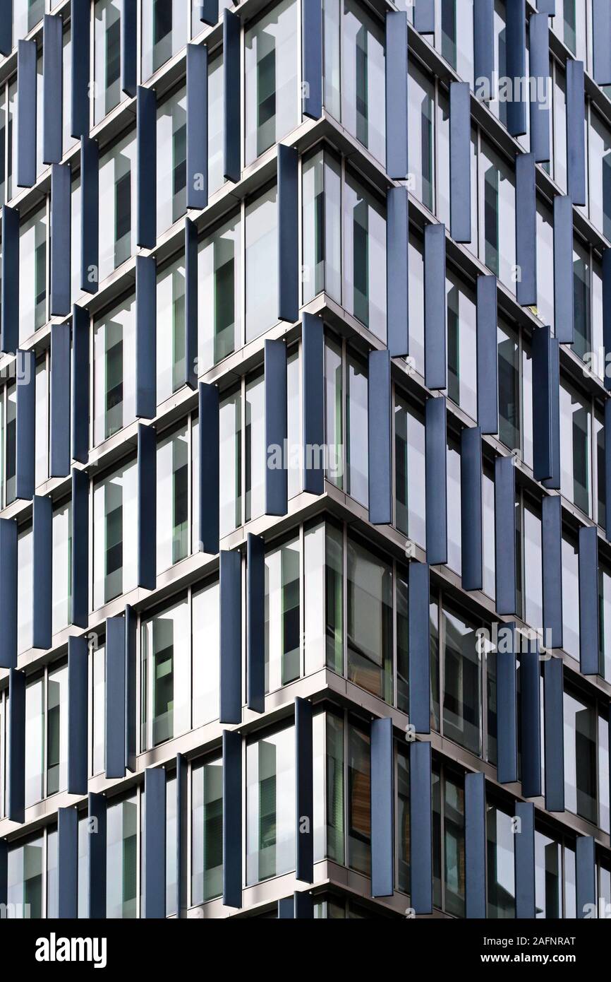 Corner of office building with blue fins Stock Photo - Alamy