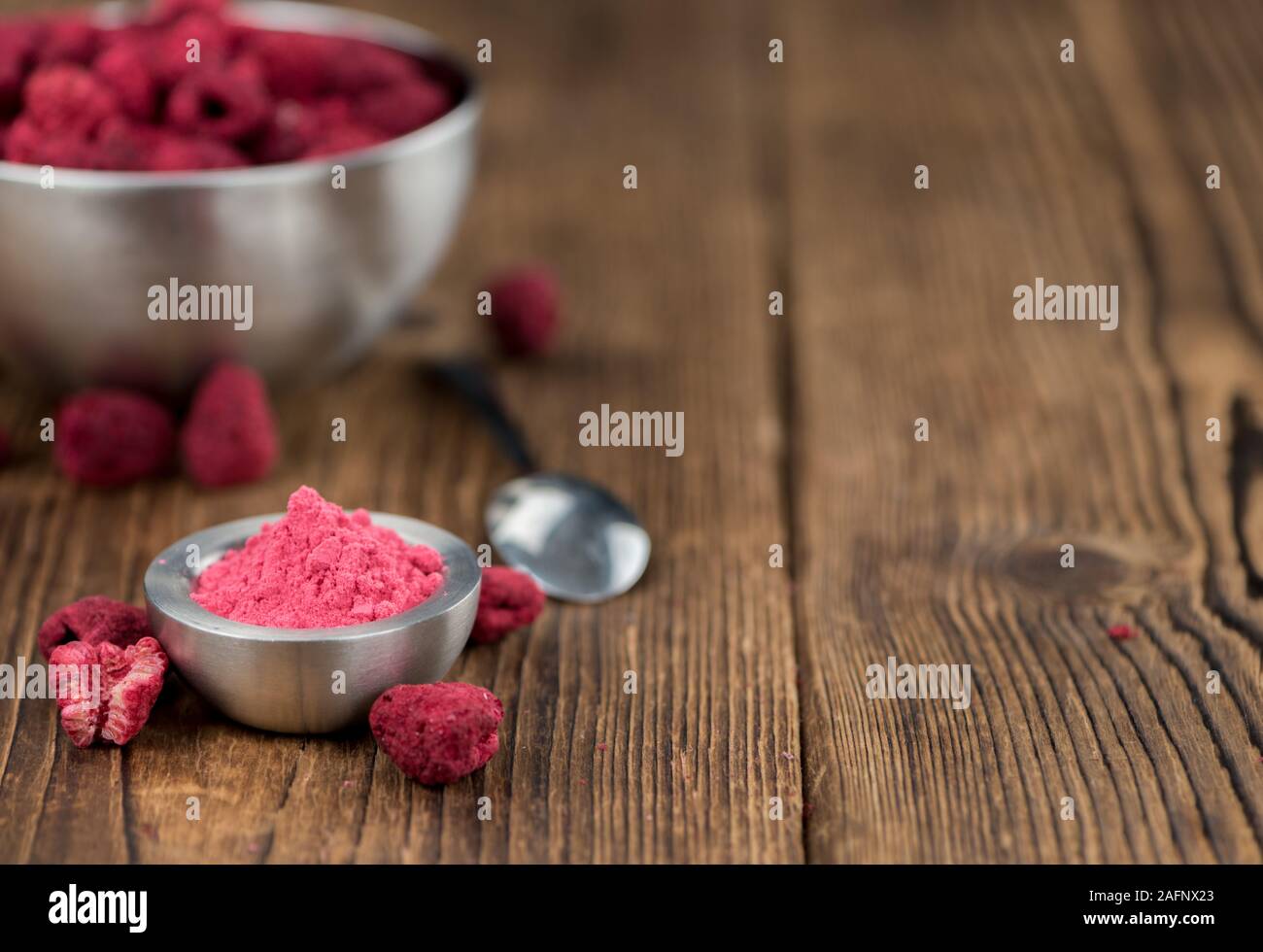 Fresh made Raspberry powder on a vintage background as detailed close ...