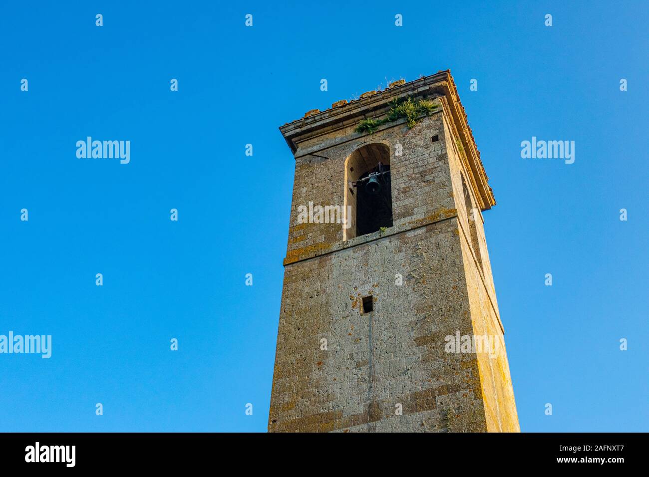 The tower bell of the little city of Onano in Lazio, Italy against blue ...