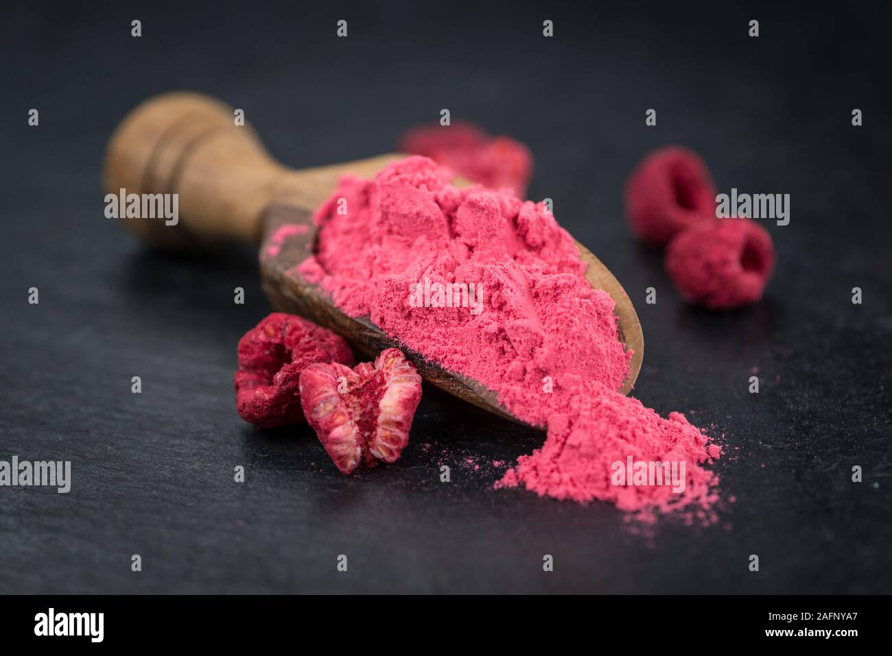 Fresh made Raspberry powder on a vintage background as detailed close ...