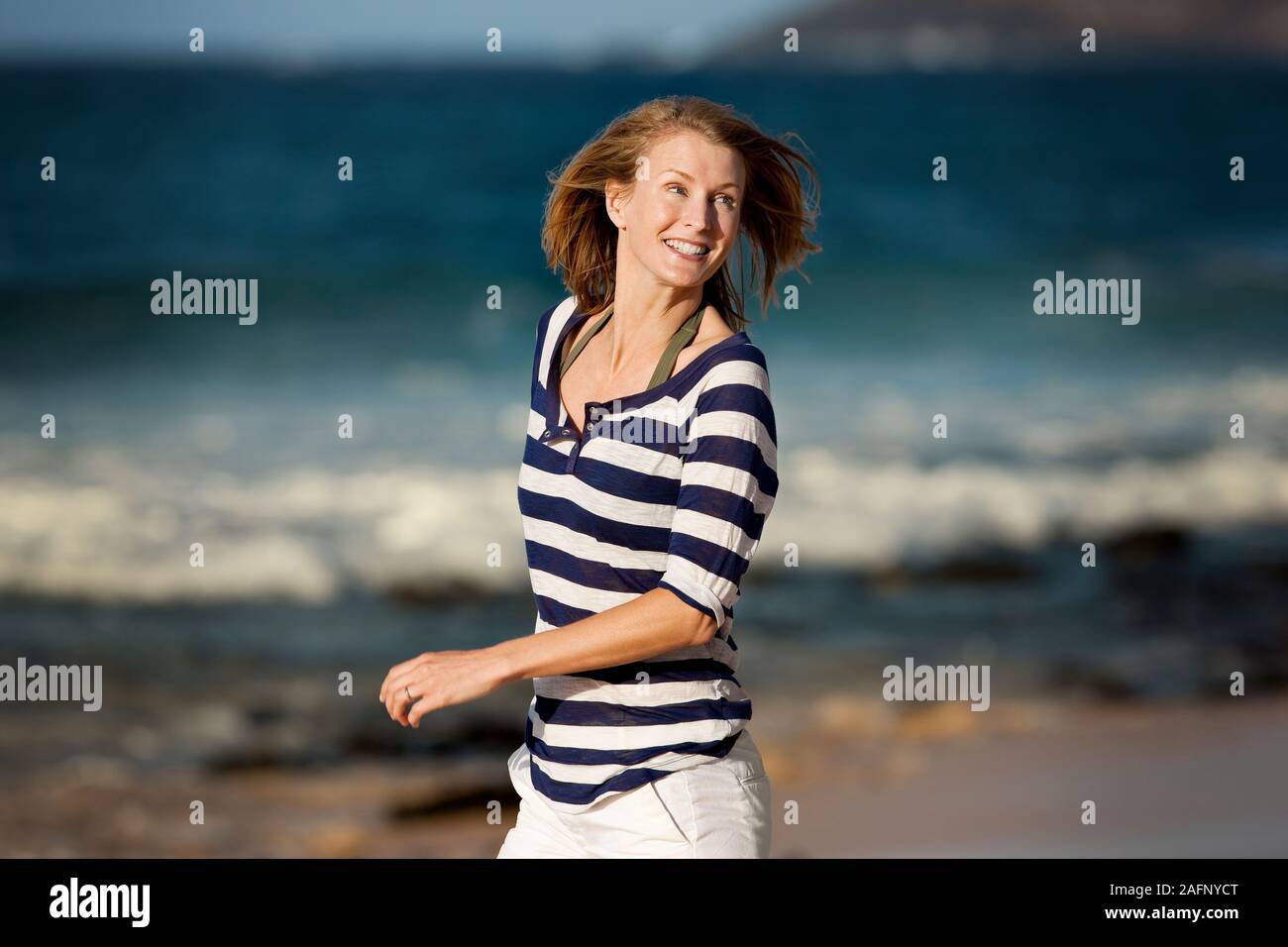 Woman stripes summer happy beach hi-res stock photography and images ...