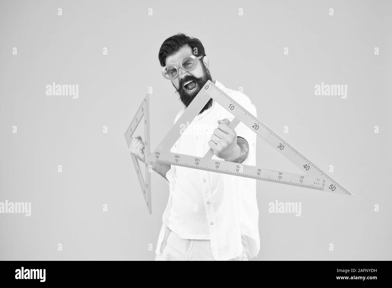 Smart student. Geometry teacher. Student using measuring instrument ...