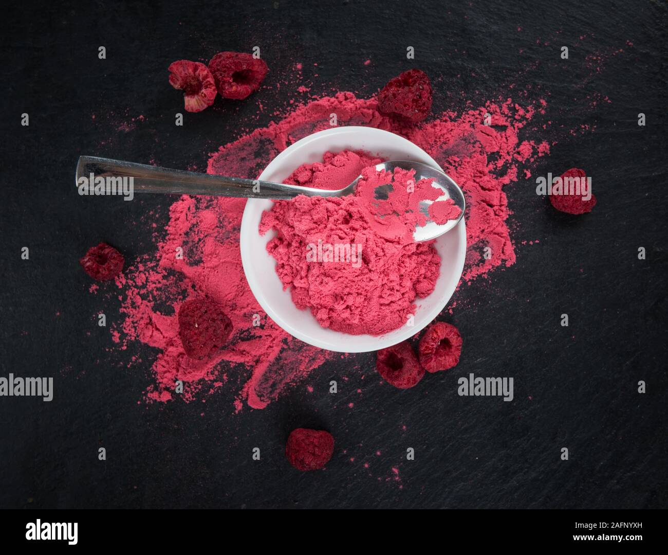 Fresh made Raspberry powder on a vintage background as detailed close ...