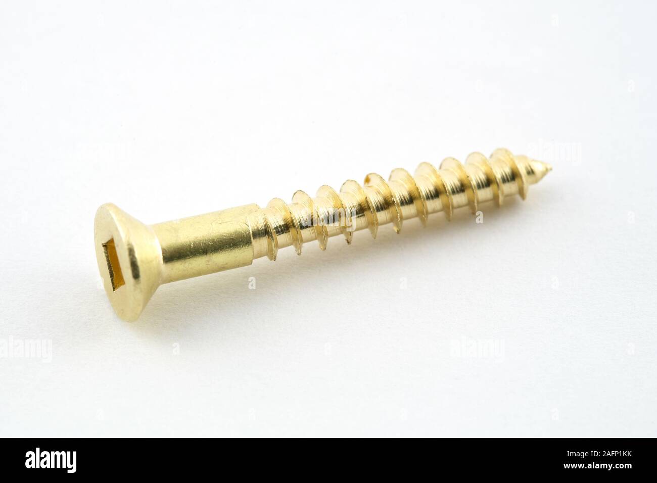 gold screw on white background Stock Photo - Alamy