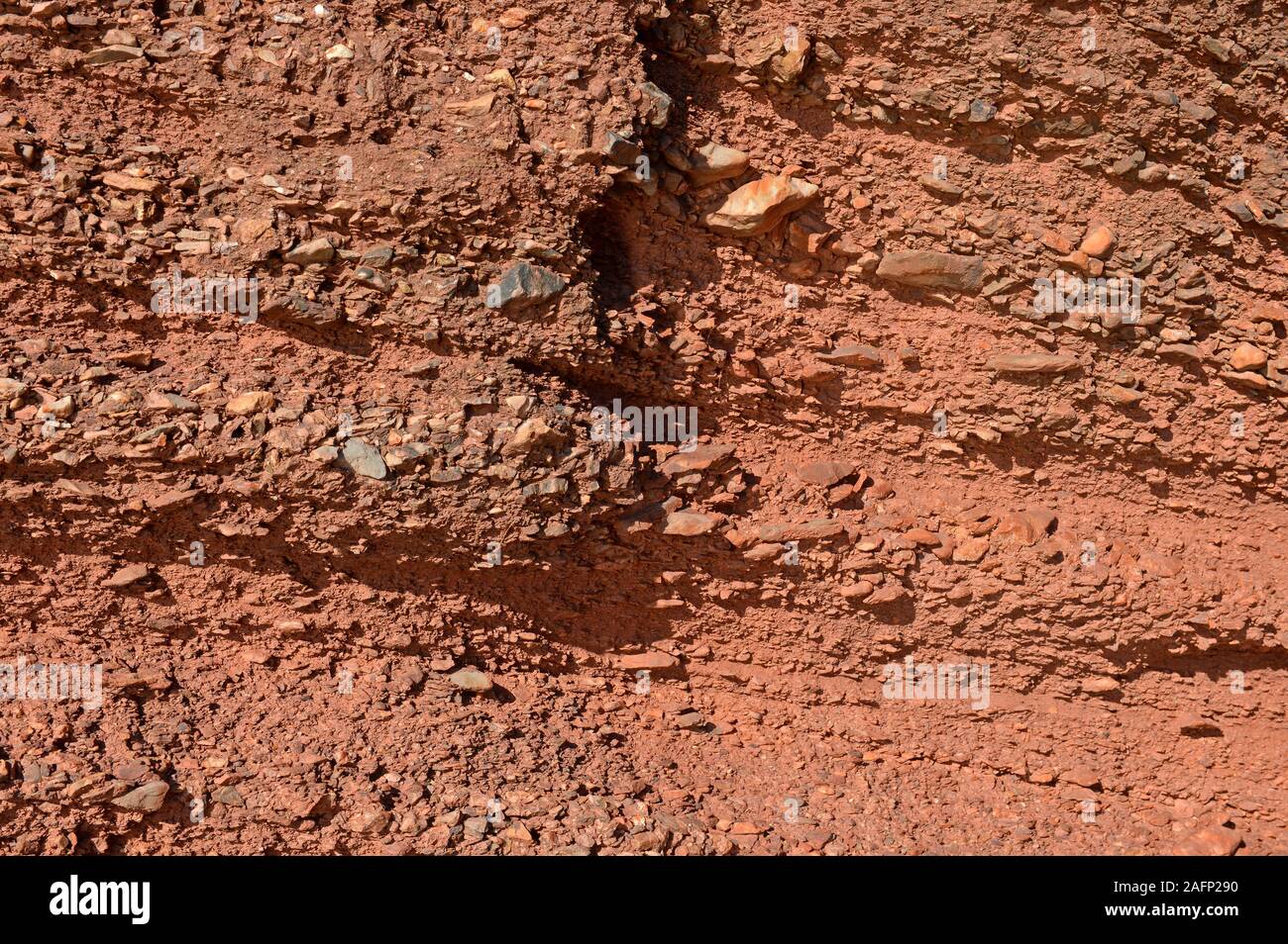Rocks, clay and pebbles in layers in Paignton, Devon, UK Stock Photo ...