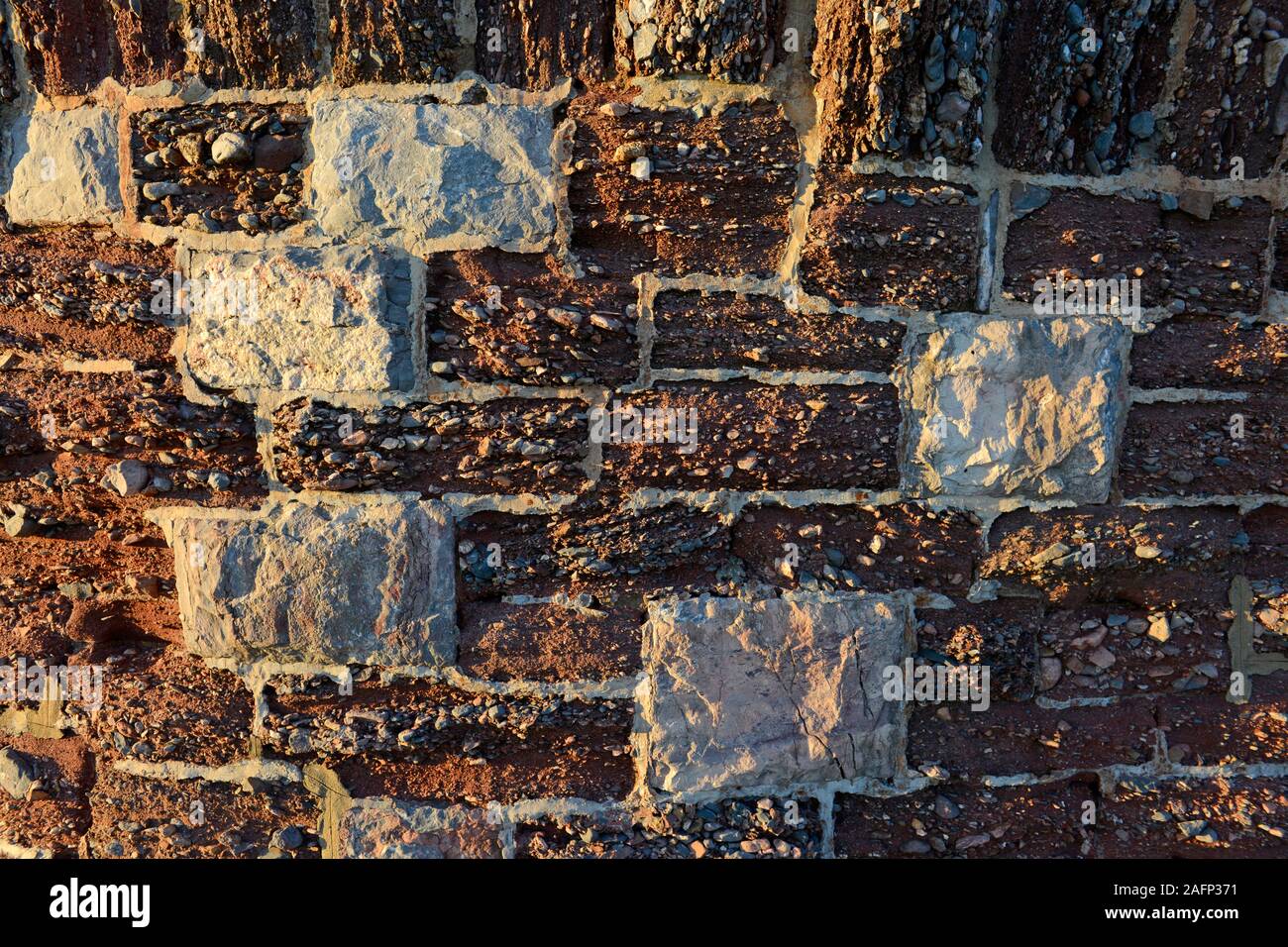 Rocks of clay and pebbles form part of a wall at Torquay in Devon Stock ...