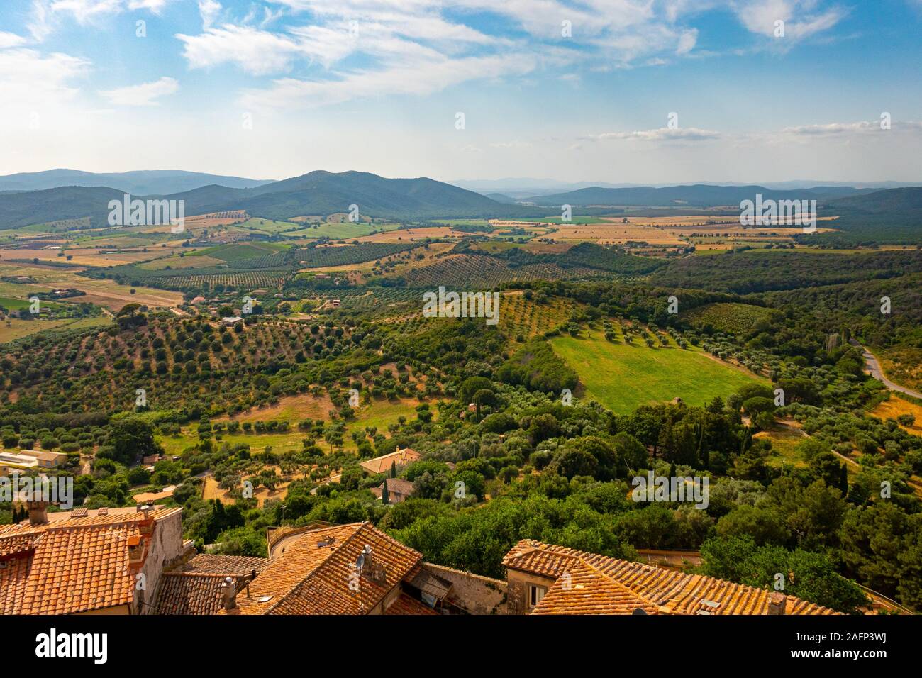 landscape from the hill of Capalbio in Tuscany with blue sky and woods ...