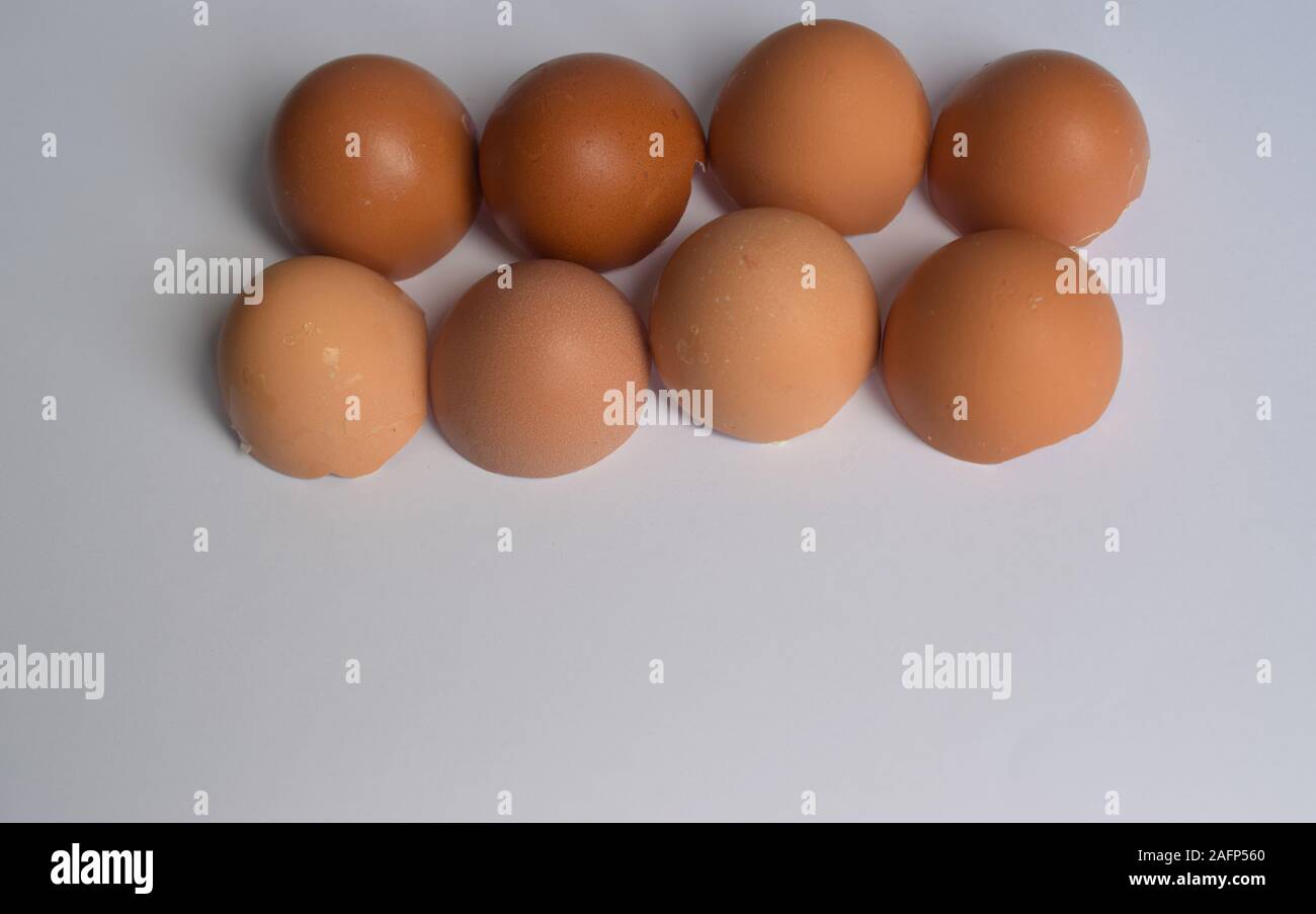 Brown chicken egg shells on light background Stock Photo - Alamy