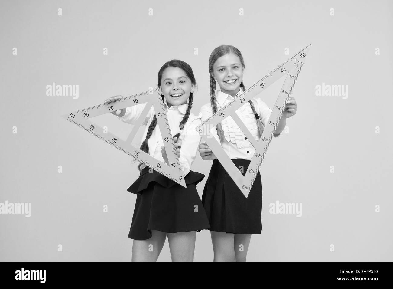 Pupil school girls big rulers. School knowledge. Explore world with ...