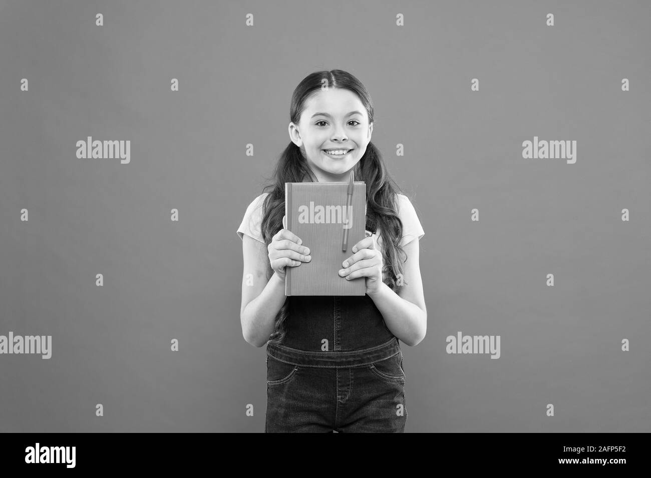 Childrens literature. happy little girl with notebook. literature ...