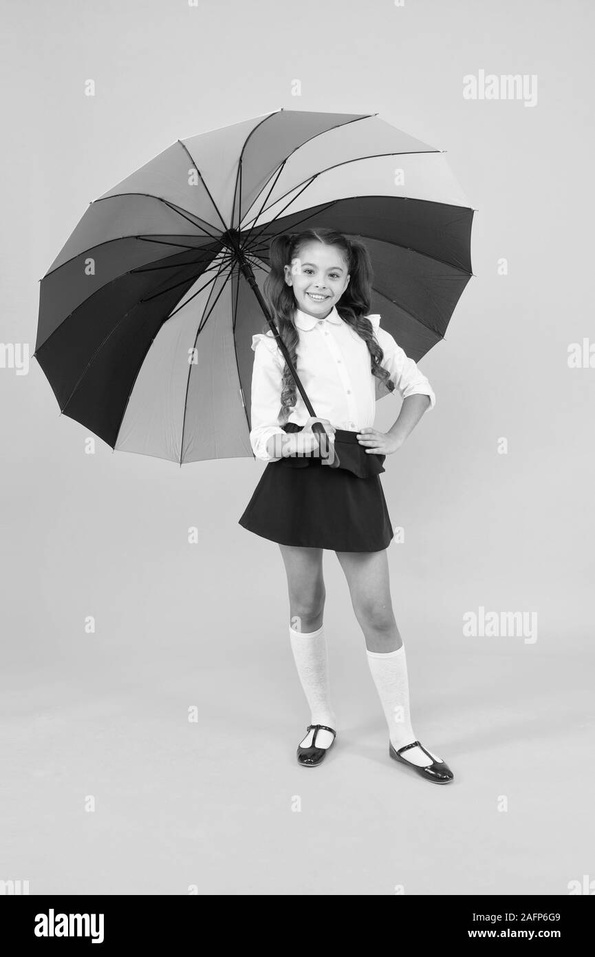 Happy childhood. Rainbow umbrella. Kid happy with umbrella. Fall weather forecast. Accessory for ...