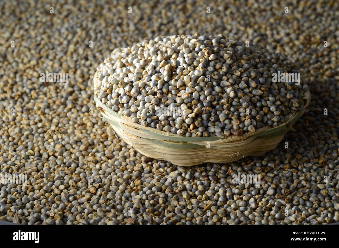 Bajra (Pearl millet) in wooden (bamboo) basket Stock Photo - Alamy