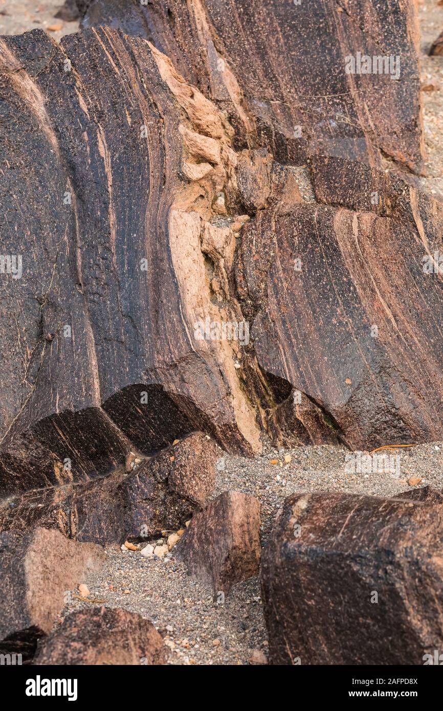 Striped andesite rock along the rim of Crater Lake in Crater Lake ...