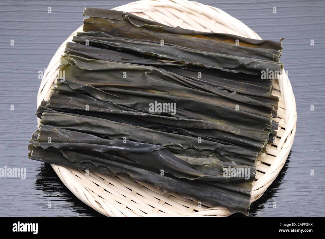 Japanese food konbu kelp in a bamboo basket Stock Photo - Alamy