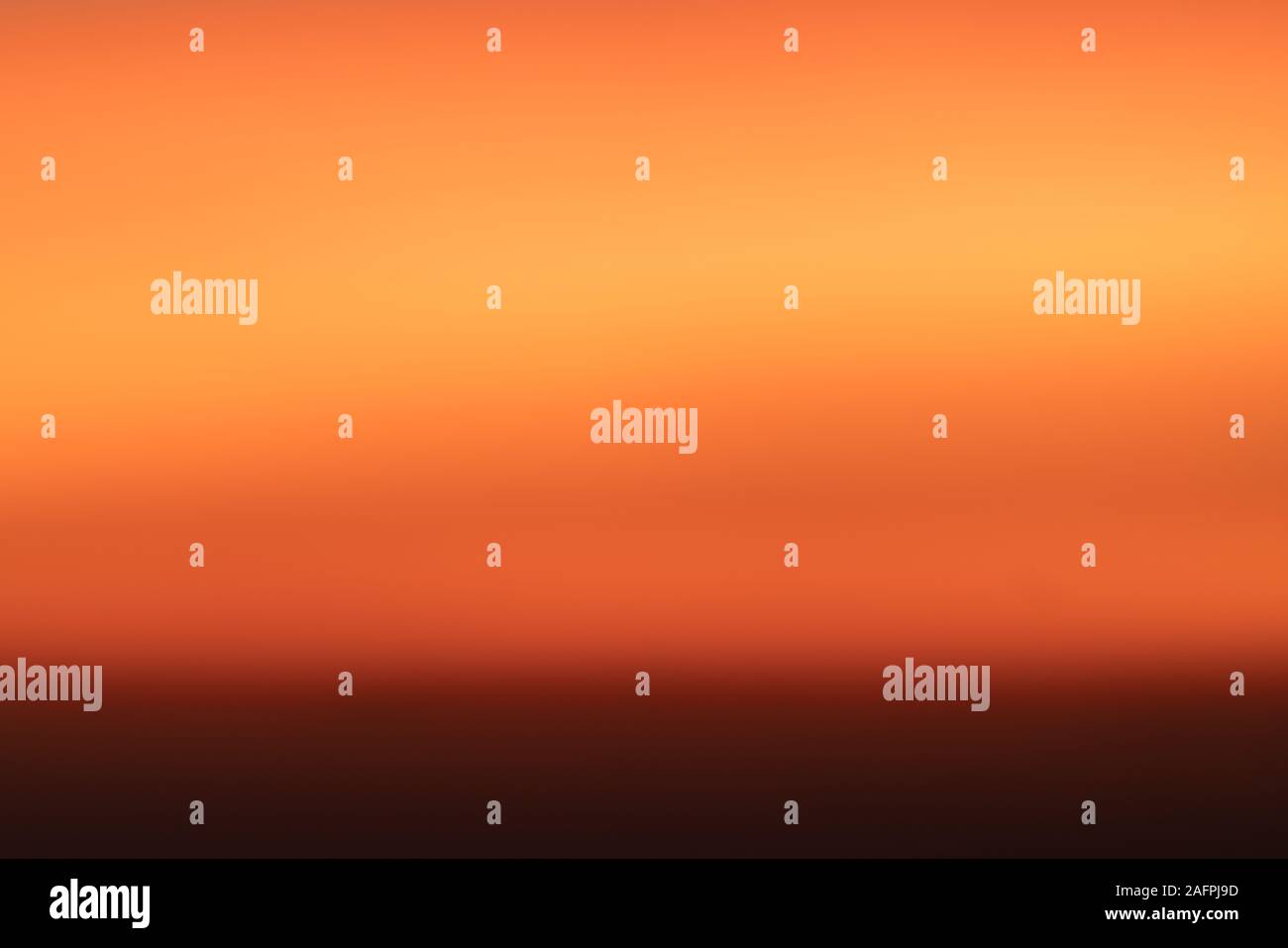Abstract sunrise or sunset background concept in deep orange hues Stock ...